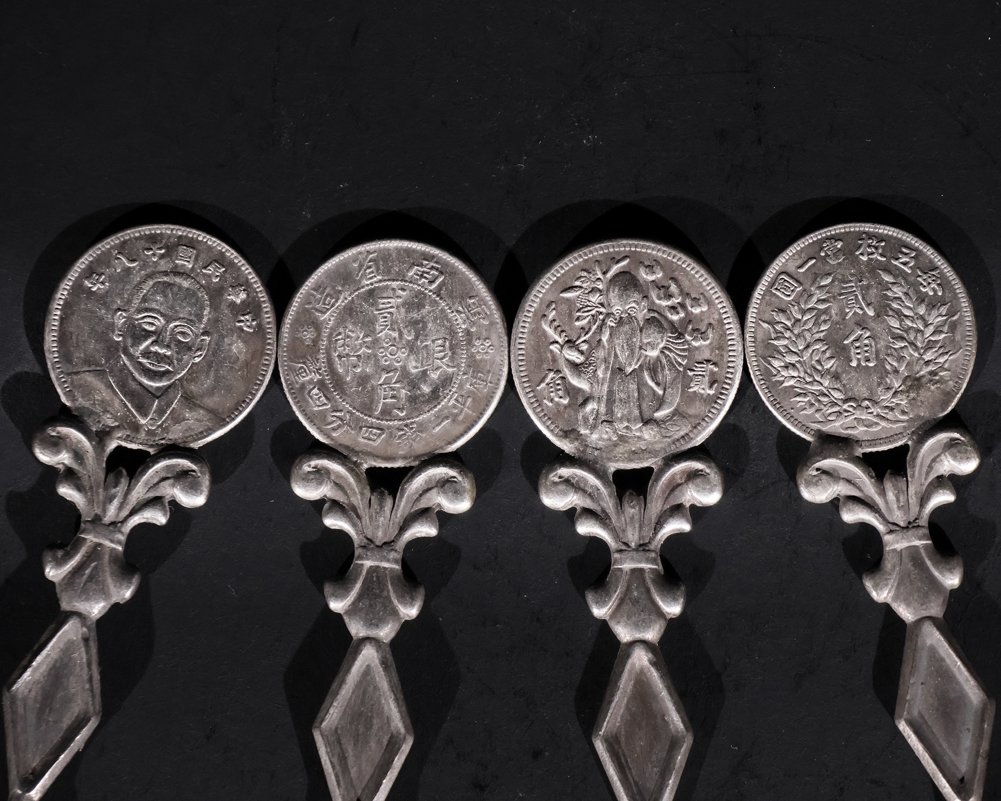 FOUR CHINESE COIN SPOONS, 20TH CENTURY