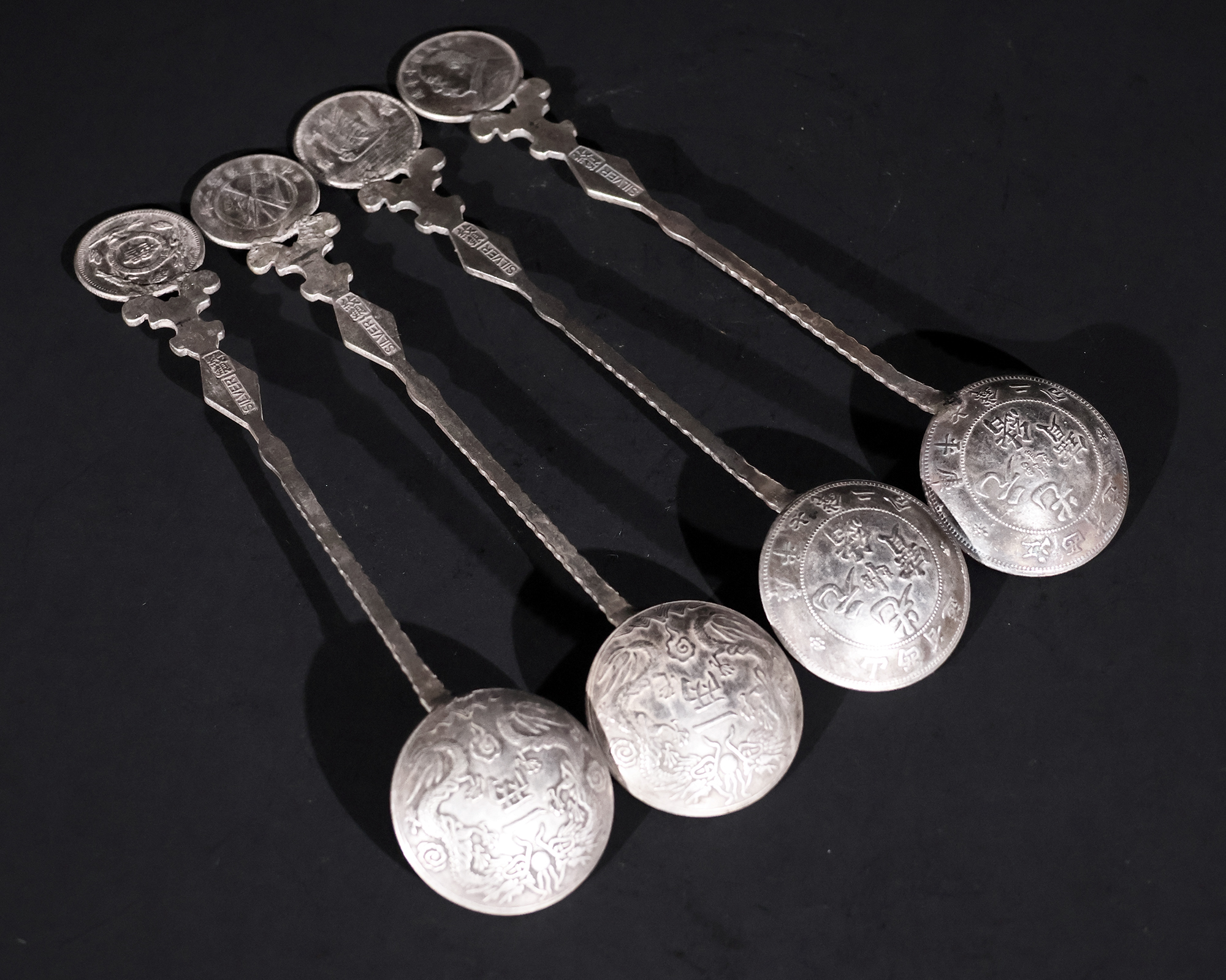 FOUR CHINESE COIN SPOONS, 20TH CENTURY