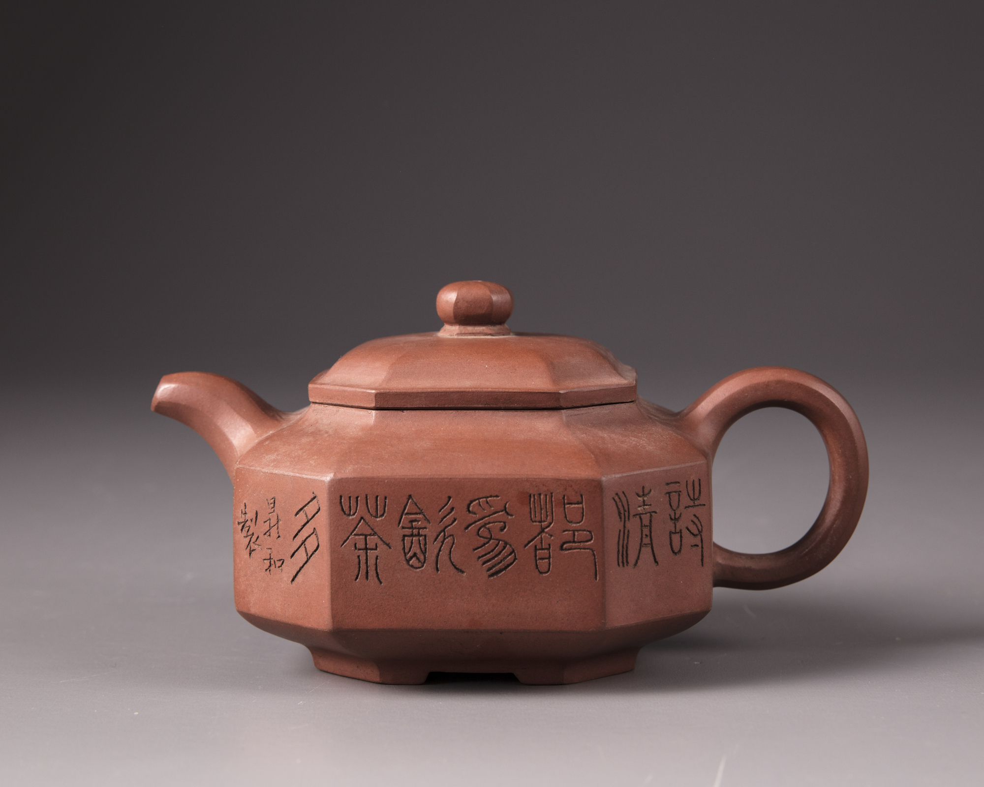 A Chinese yixing 'inscribed' hexagonal teapot
