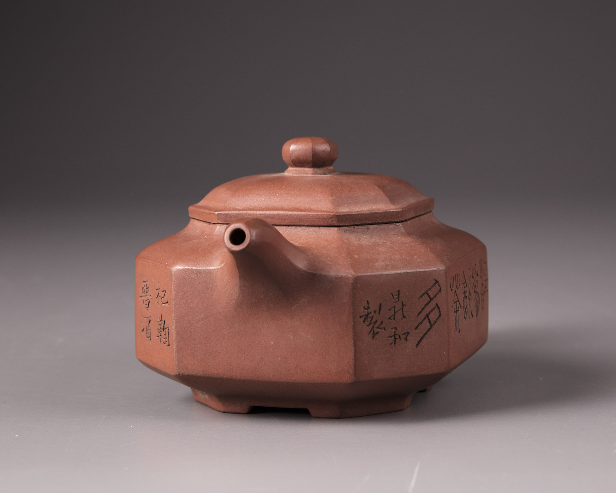 A Chinese yixing 'inscribed' hexagonal teapot