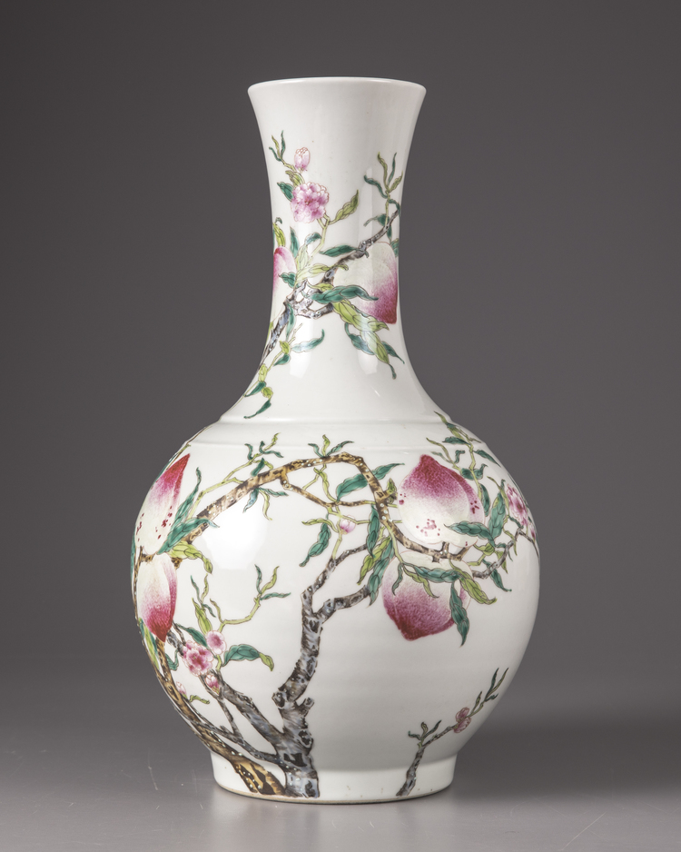 A Chinese famille rose 'Eight Peaches' bottle vase