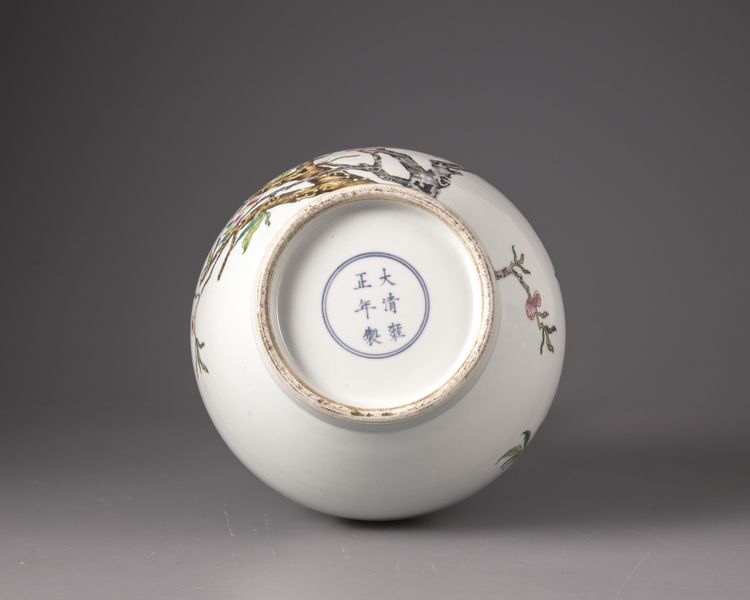 A Chinese famille rose 'Eight Peaches' bottle vase