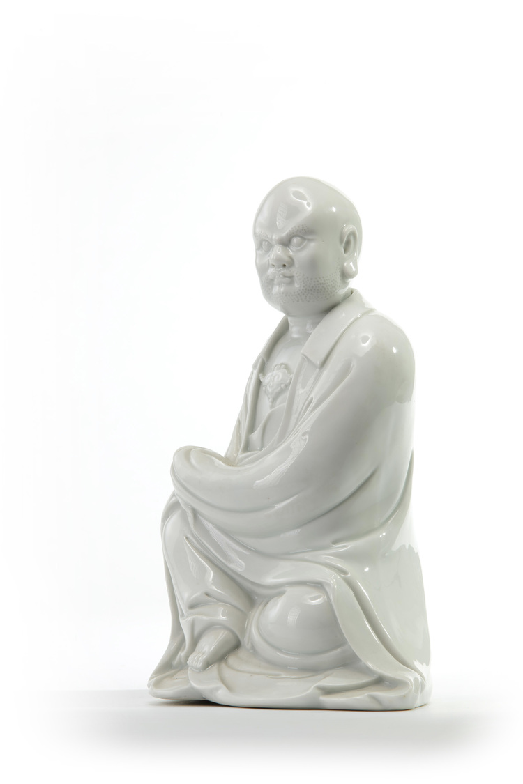 A Chinese Dehua figure of a seated Luohan