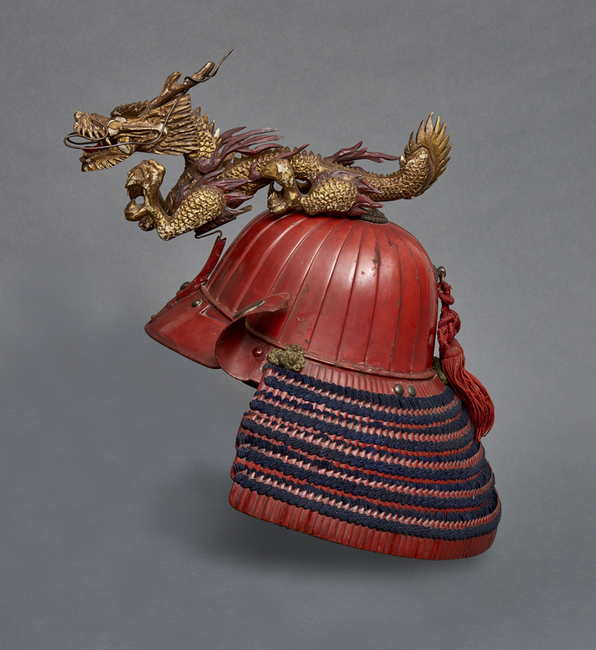 A red lacquered twenty-four plate sujikabuto-helmet with five neck ...